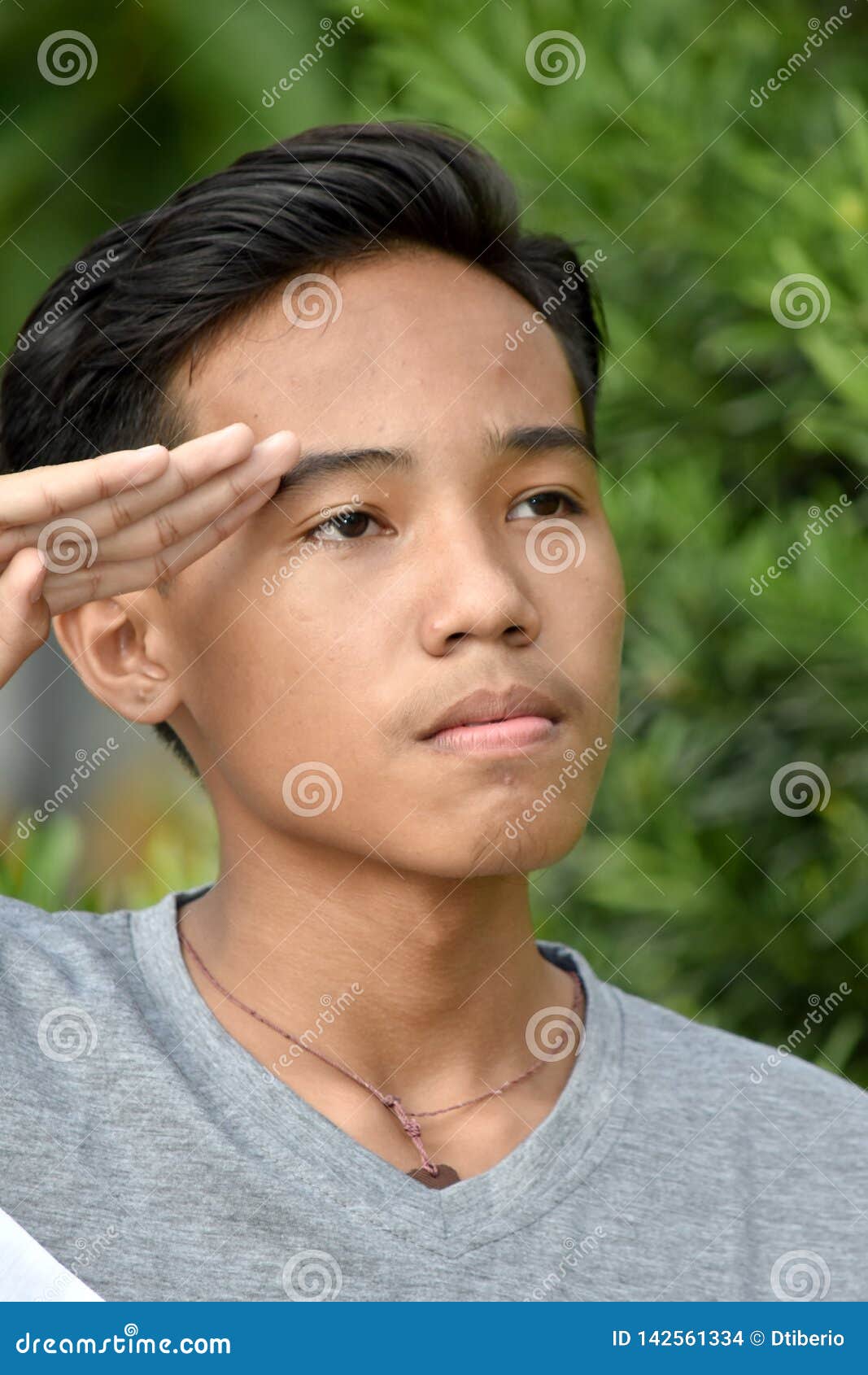 Saluting Good Looking Boy stock photo. Image of viewing - 142561334