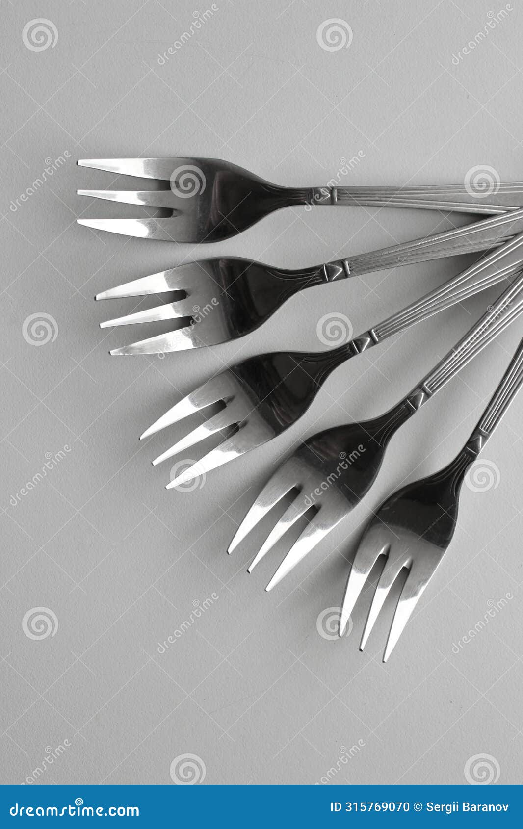 Same Three Pronged Forks Laid Out in a Fan Shape Isolated on White ...