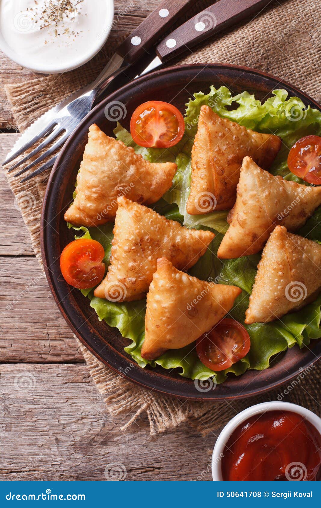 Samosa on a Plate with Sauce Closeup, Vertical Top View Stock Photo ...