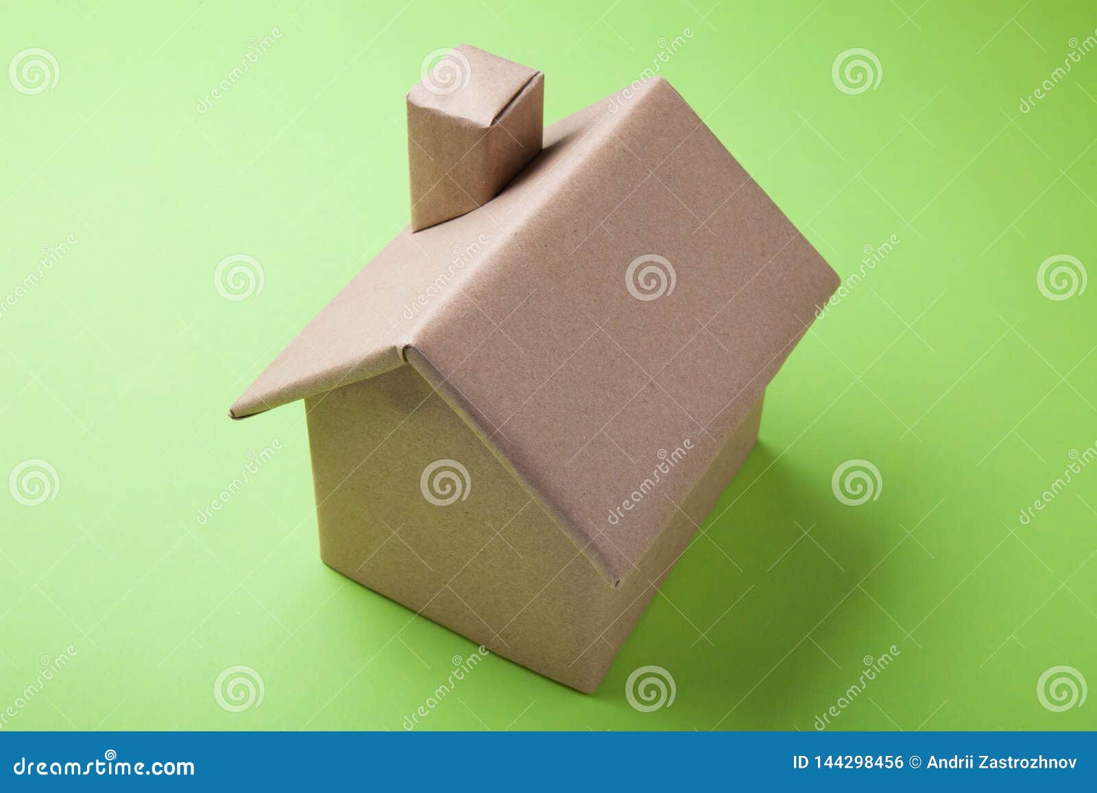 A Sample of a Dwelling House is Made of Cardboard. Green Background ...