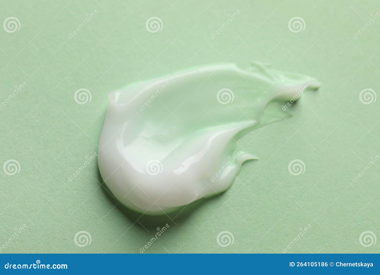 Sample of Face Cream on Light Green Background, Top View Stock Photo ...