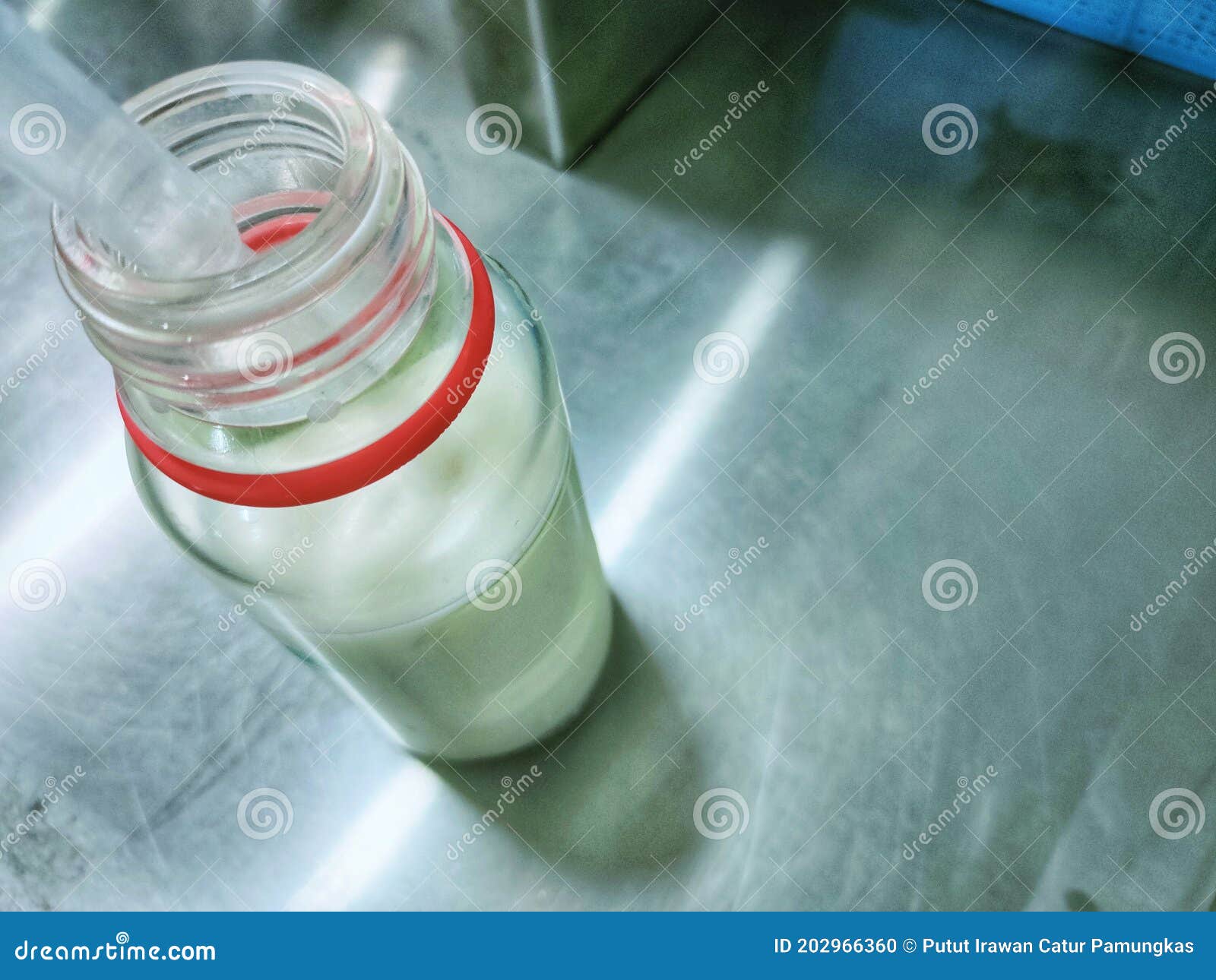 Sample of Milk in a Bottle stock photo. Image of milk - 202966360