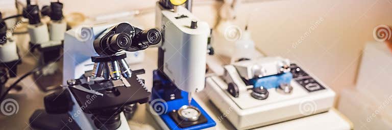 A Sample Preparation Table in a Laboratory with an Optical Microscope ...