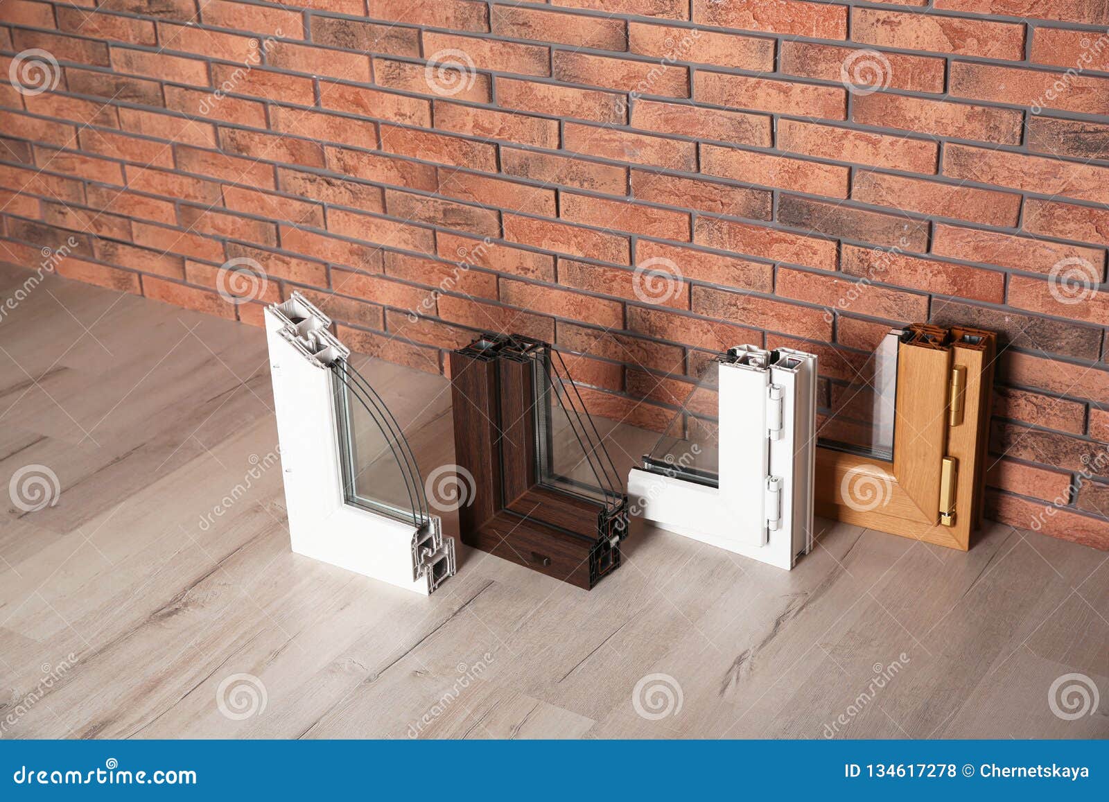 Samples of Modern Window Profiles on Floor Against Brick Wall. Stock ...
