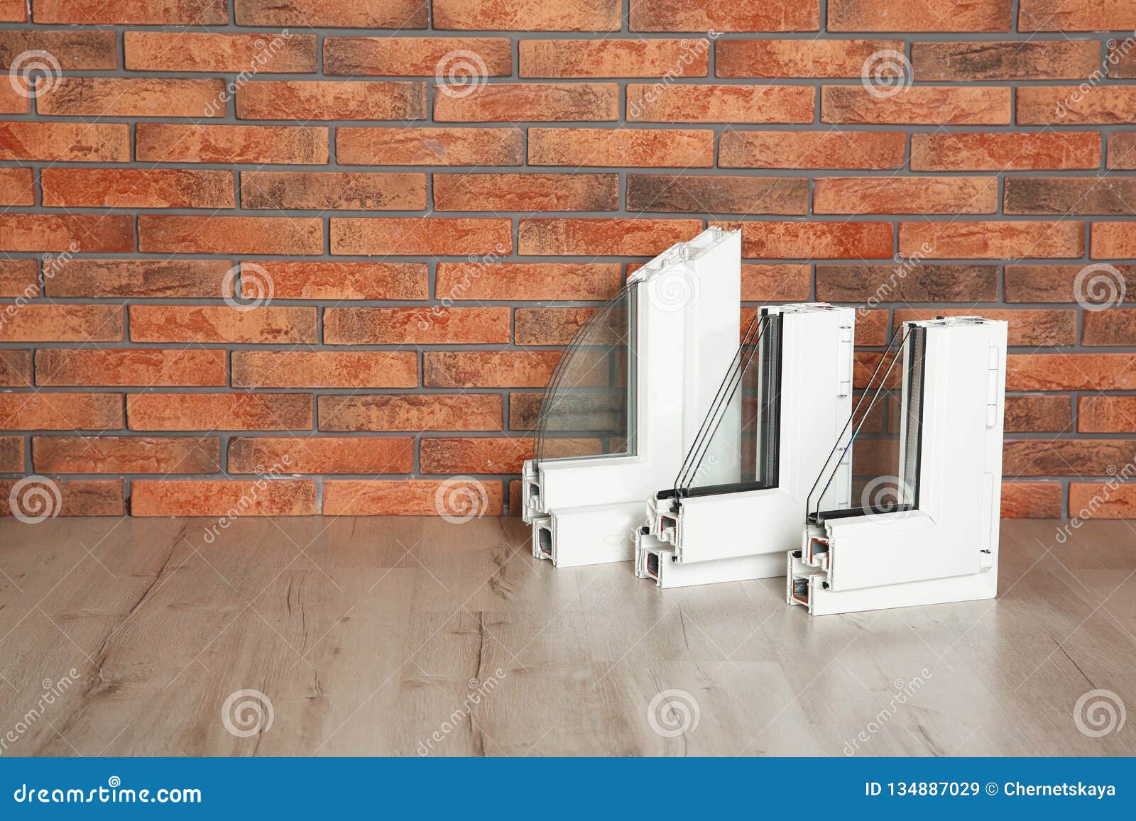 Samples of Modern Window Profiles on Floor Against Brick Wall, Space ...