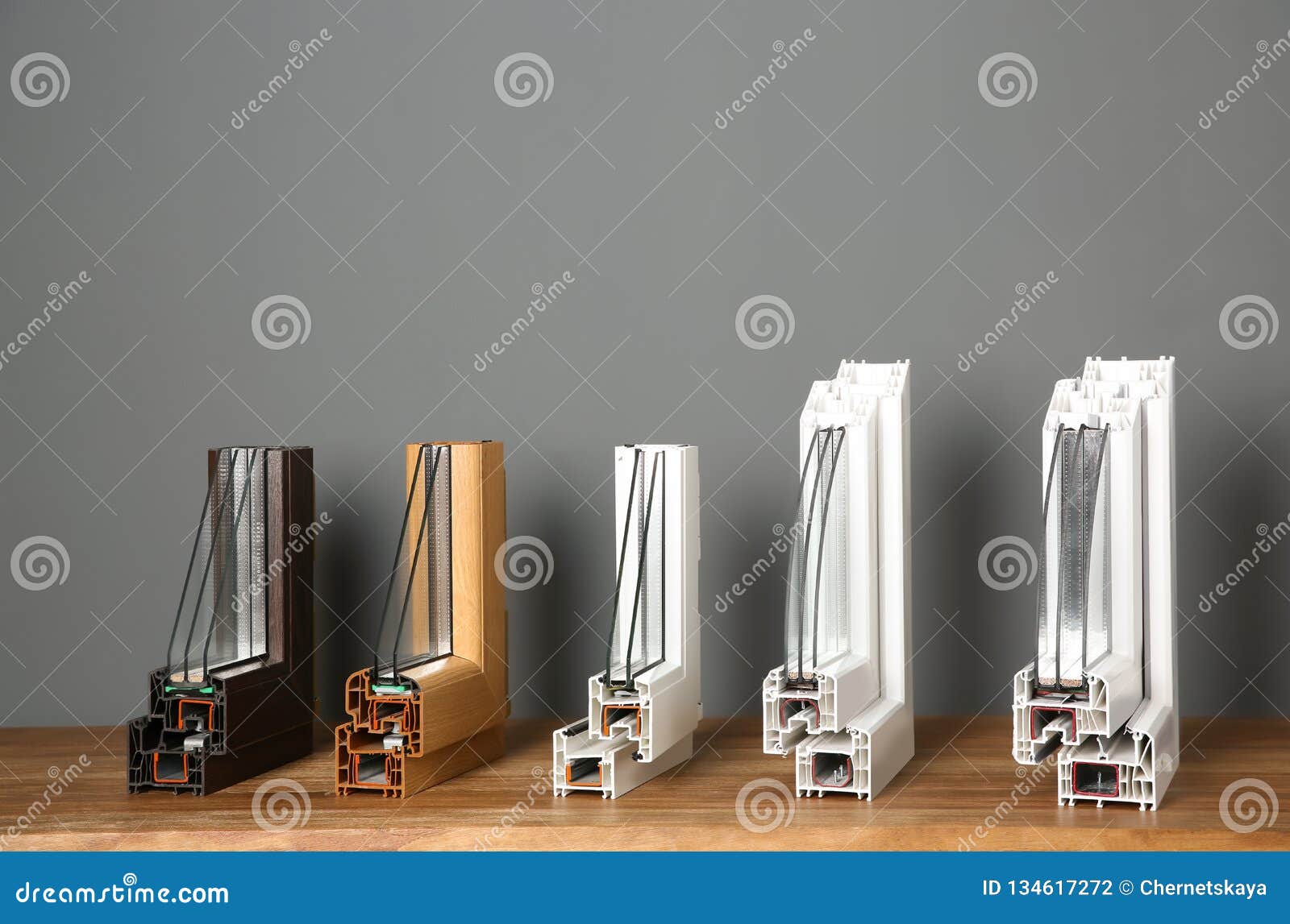 Samples of Modern Window Profiles on Table Against Gray Wall Stock ...
