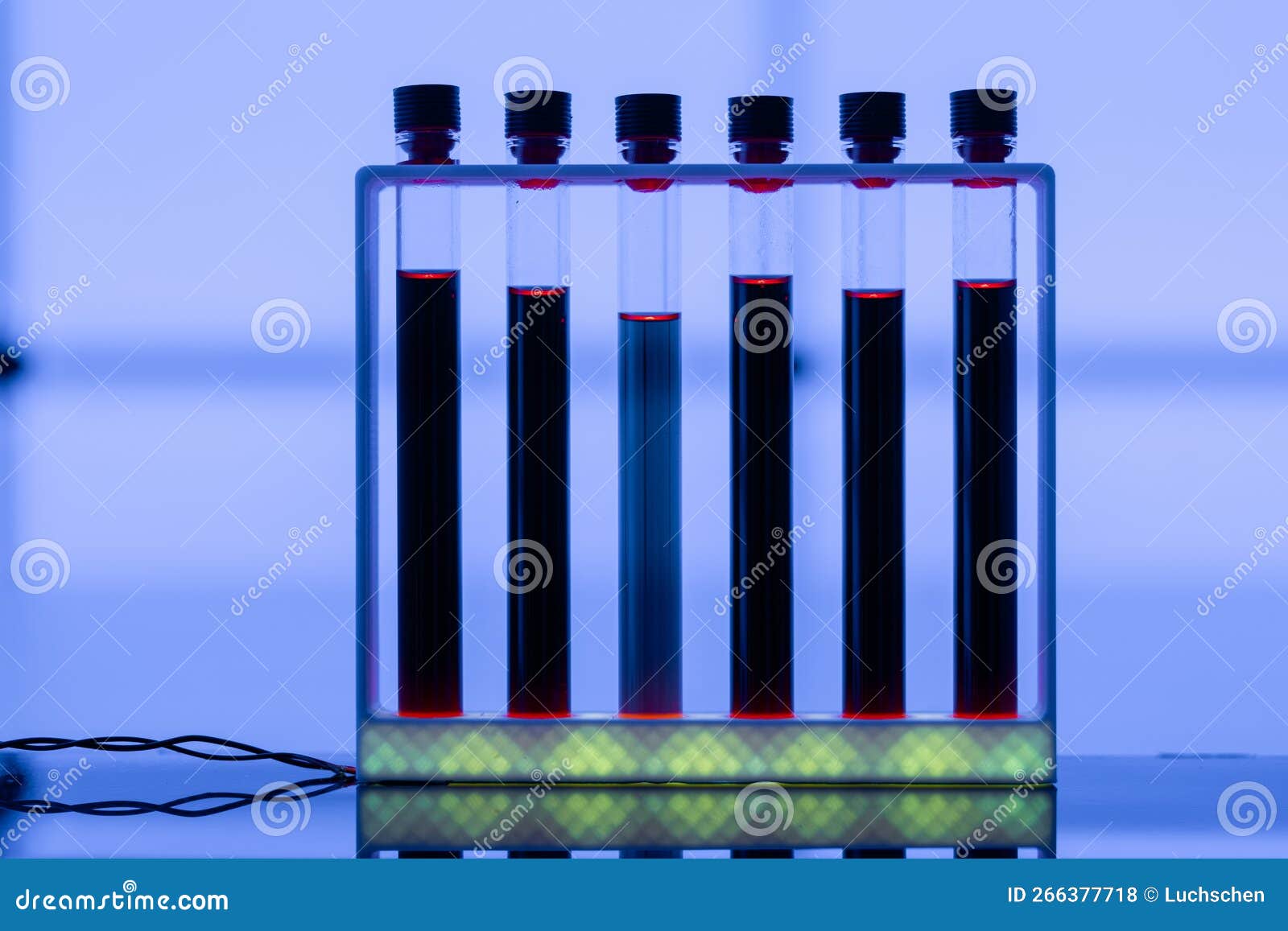 Samples of Radioactive Liquid in Test Tubes in a Nuclear Physics ...