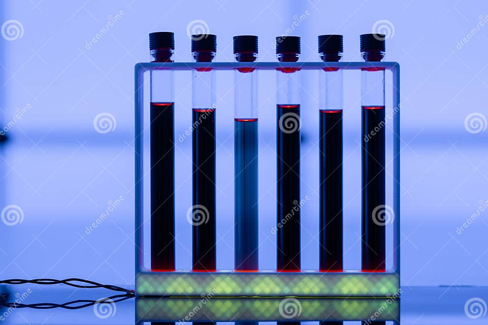 Samples of Radioactive Liquid in Test Tubes in a Nuclear Physics ...