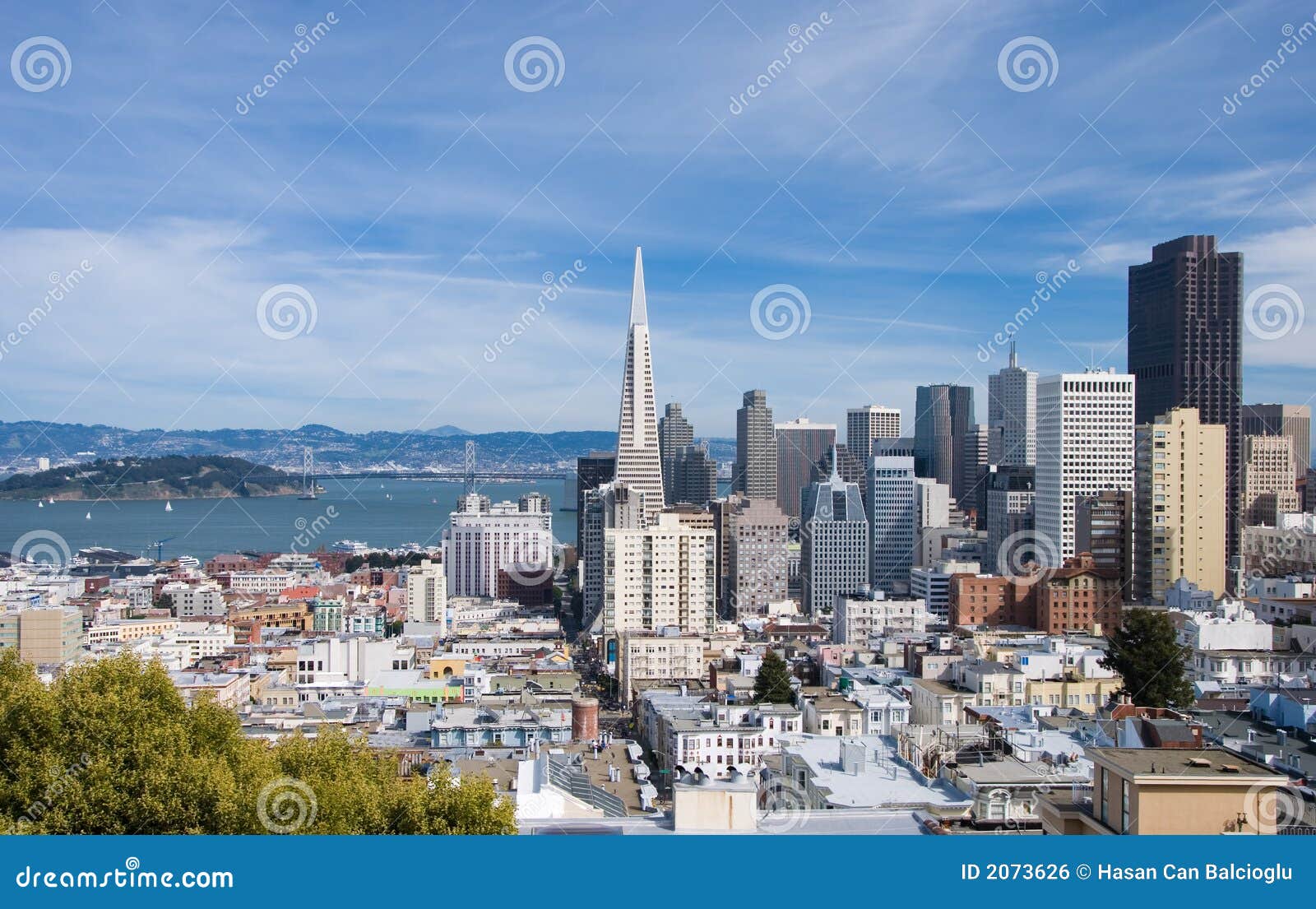 San Francisco Skyline With Oakland Bay Bridge At Sunset, California ...