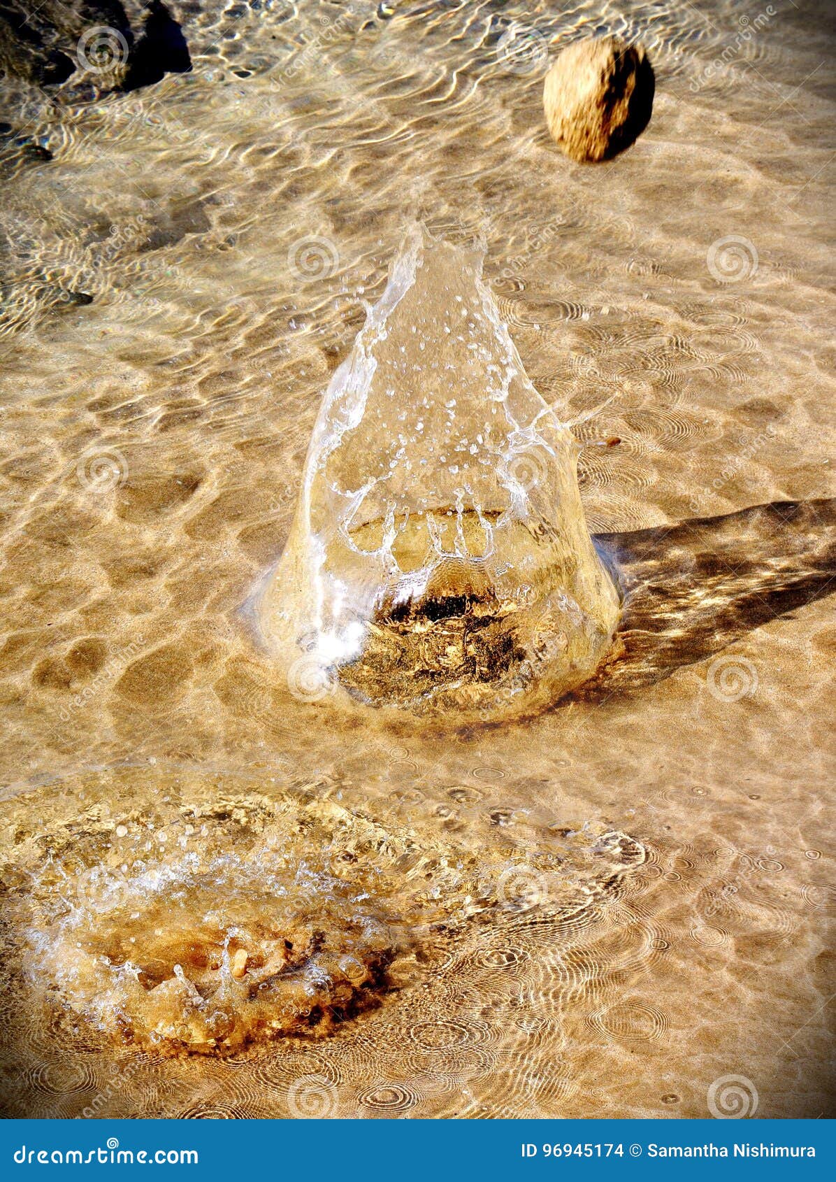 Sand Ball Goes Splash stock photo. Image of sand, ball - 96945174