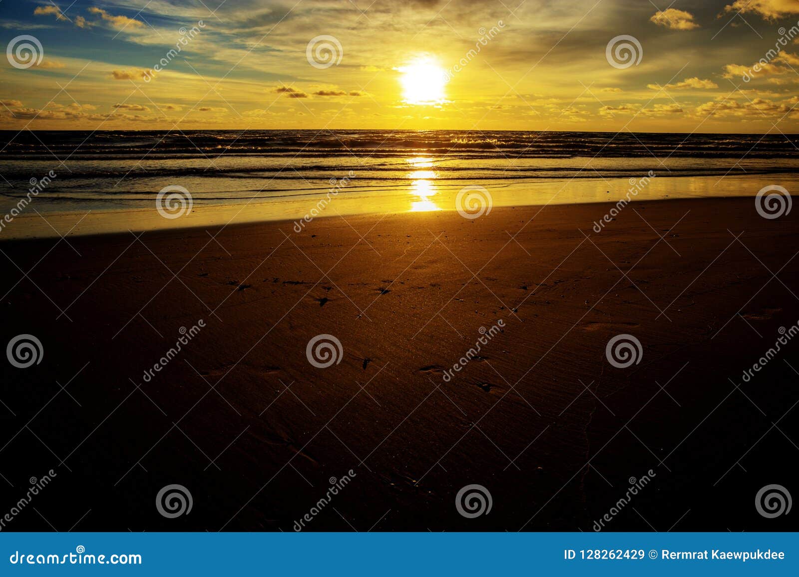 Sand beach with sunset. stock image. Image of cloud - 128262429