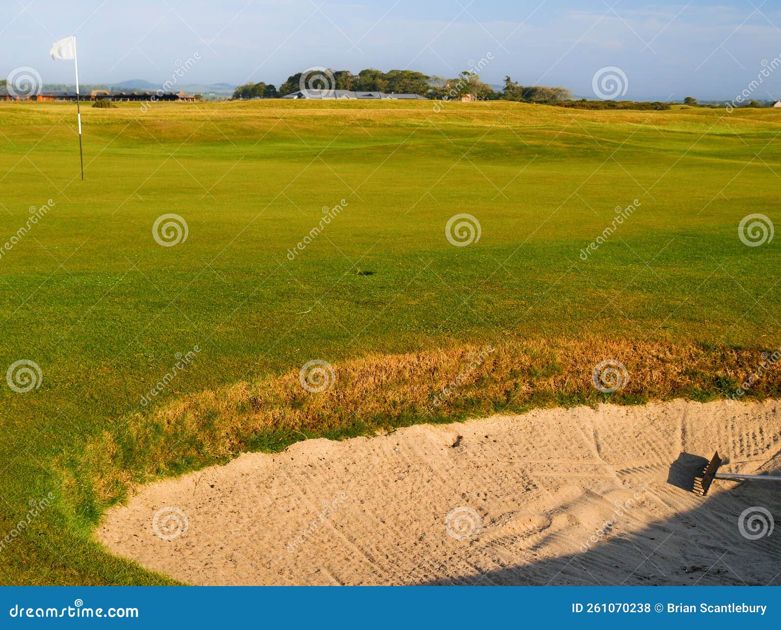Sand bunker on golf course stock photo. Image of hole - 261070238