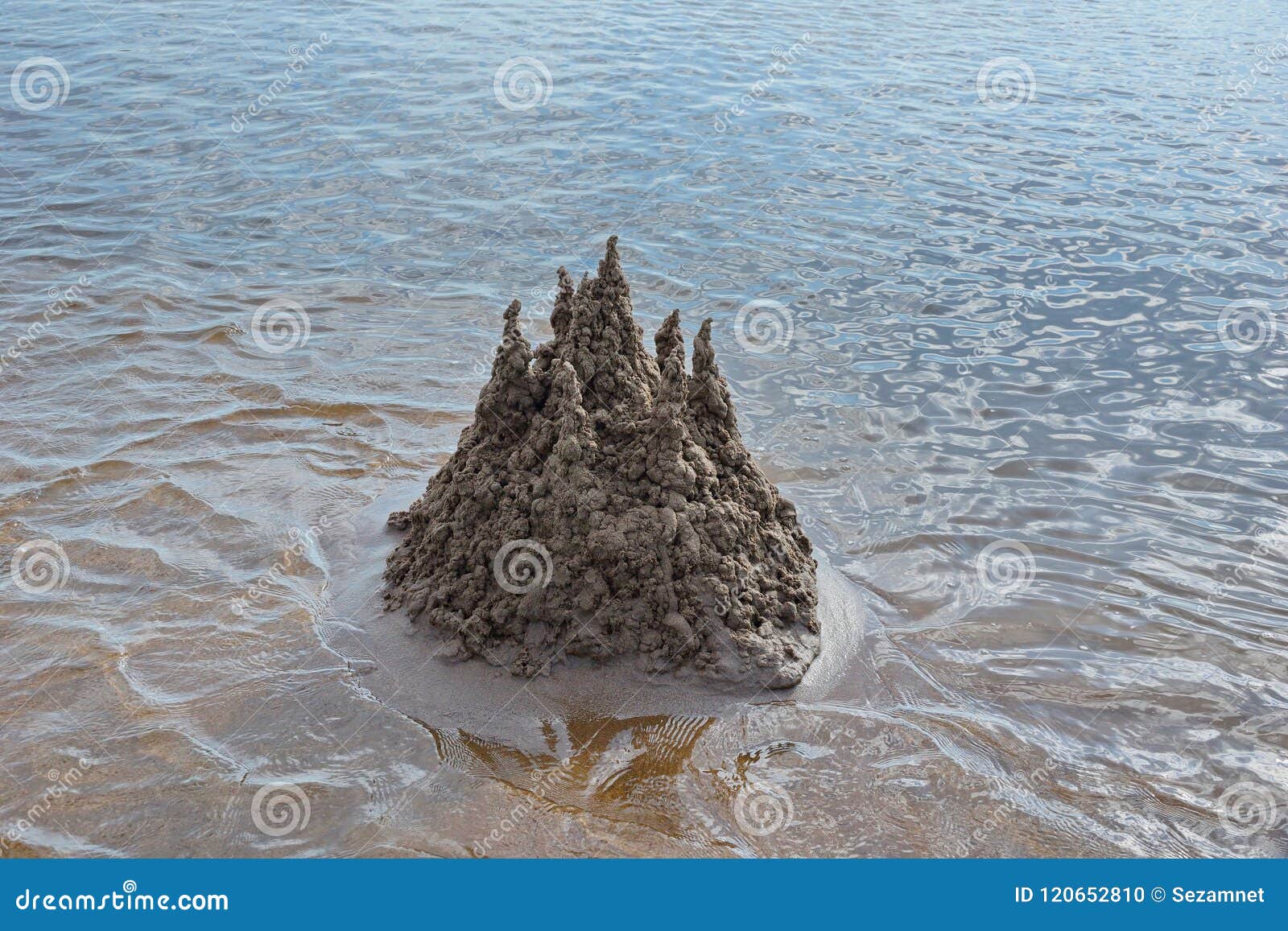 Sand Castle on the Beach Against the Water Stock Photo - Image of ...