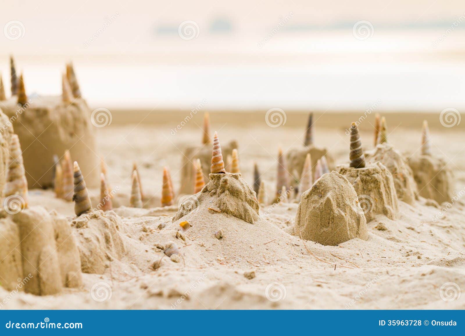 Sand castle on the beach stock photo. Image of chedi - 35963728