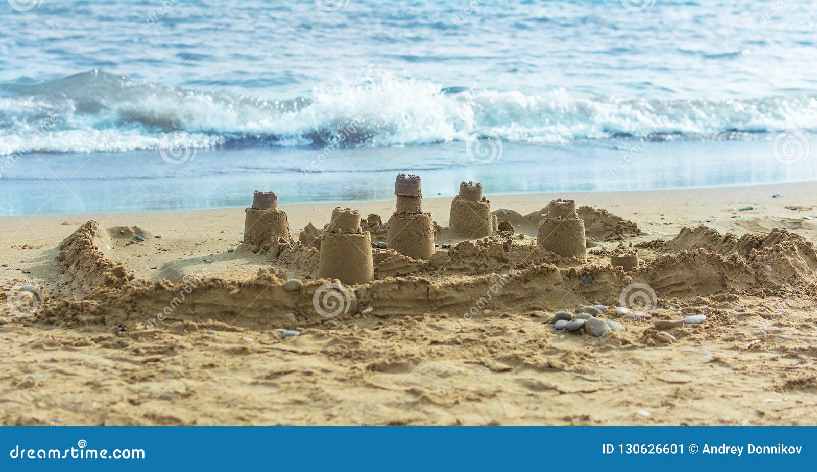 Sand castle on the beach stock image. Image of coast - 130626601