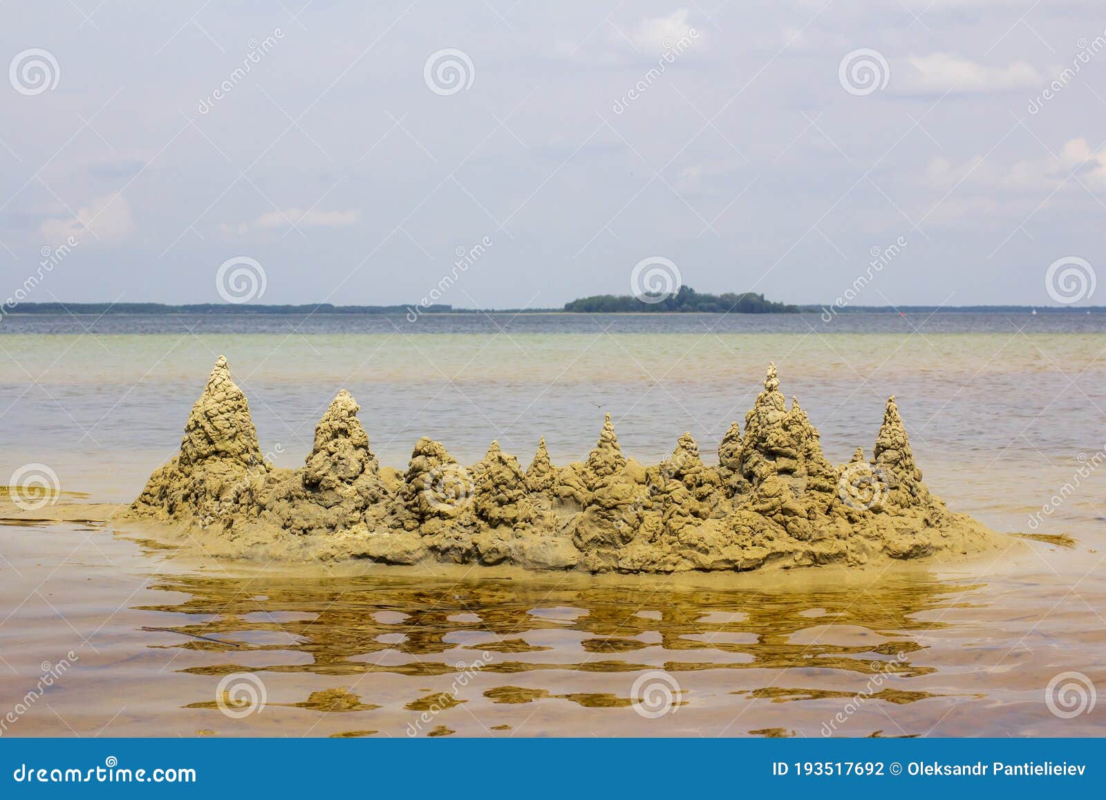 Sand castle in lake water stock photo. Image of sand - 193517692