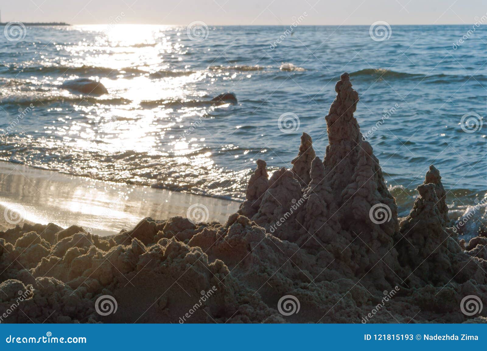 Sand Castle on the Sea Shore, Sand Castle at Sunset by the Sea Stock ...