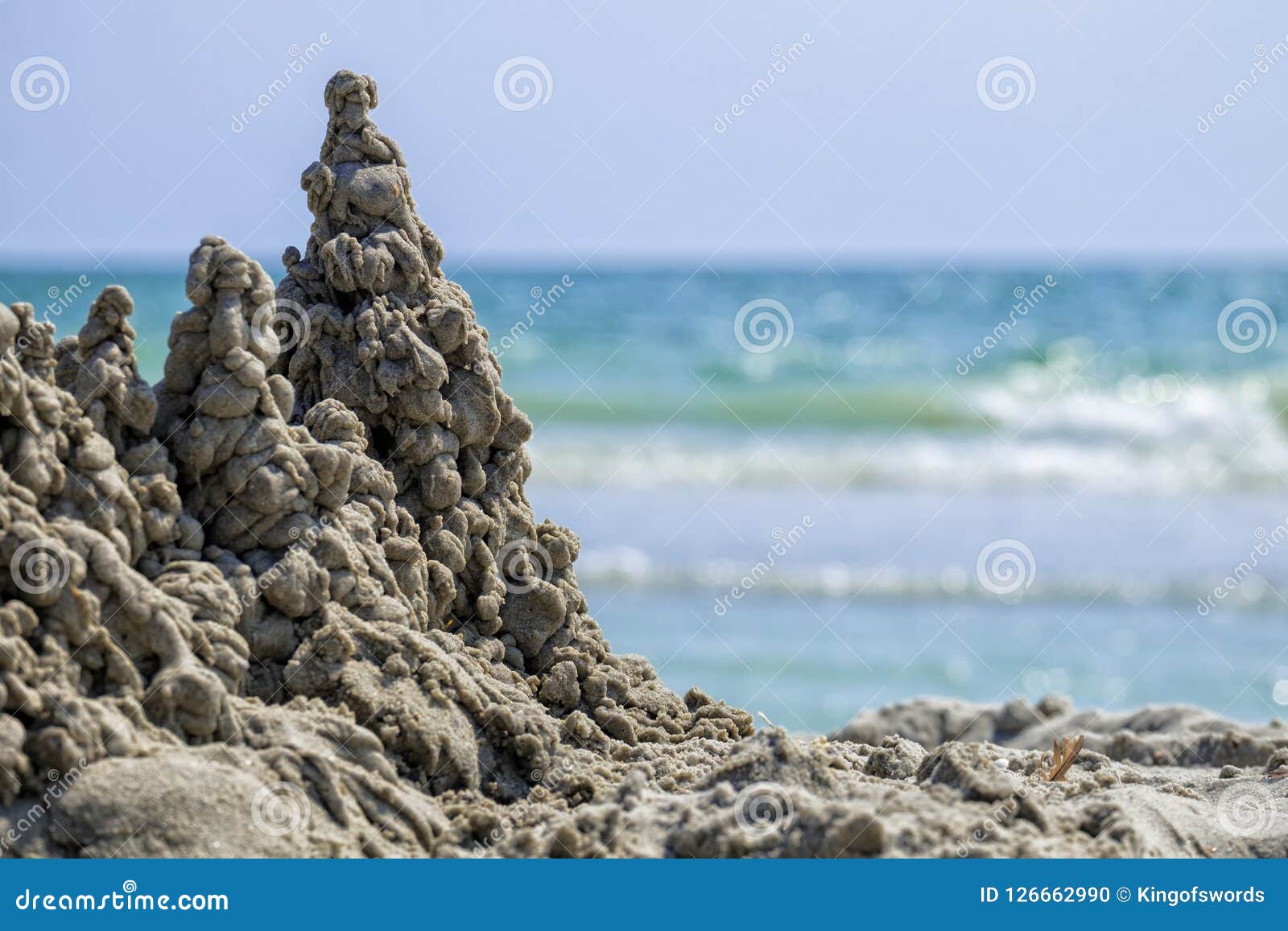 Sand castle on the shore stock photo. Image of seascape - 126662990