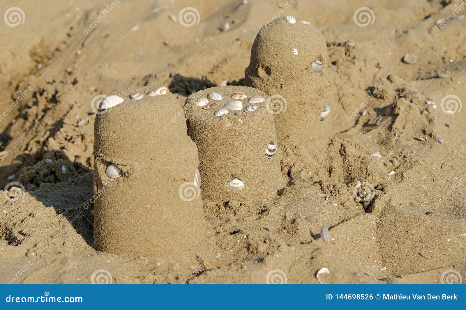 Sand Castles on the Beach with Water Shells Stock Photo - Image of ...