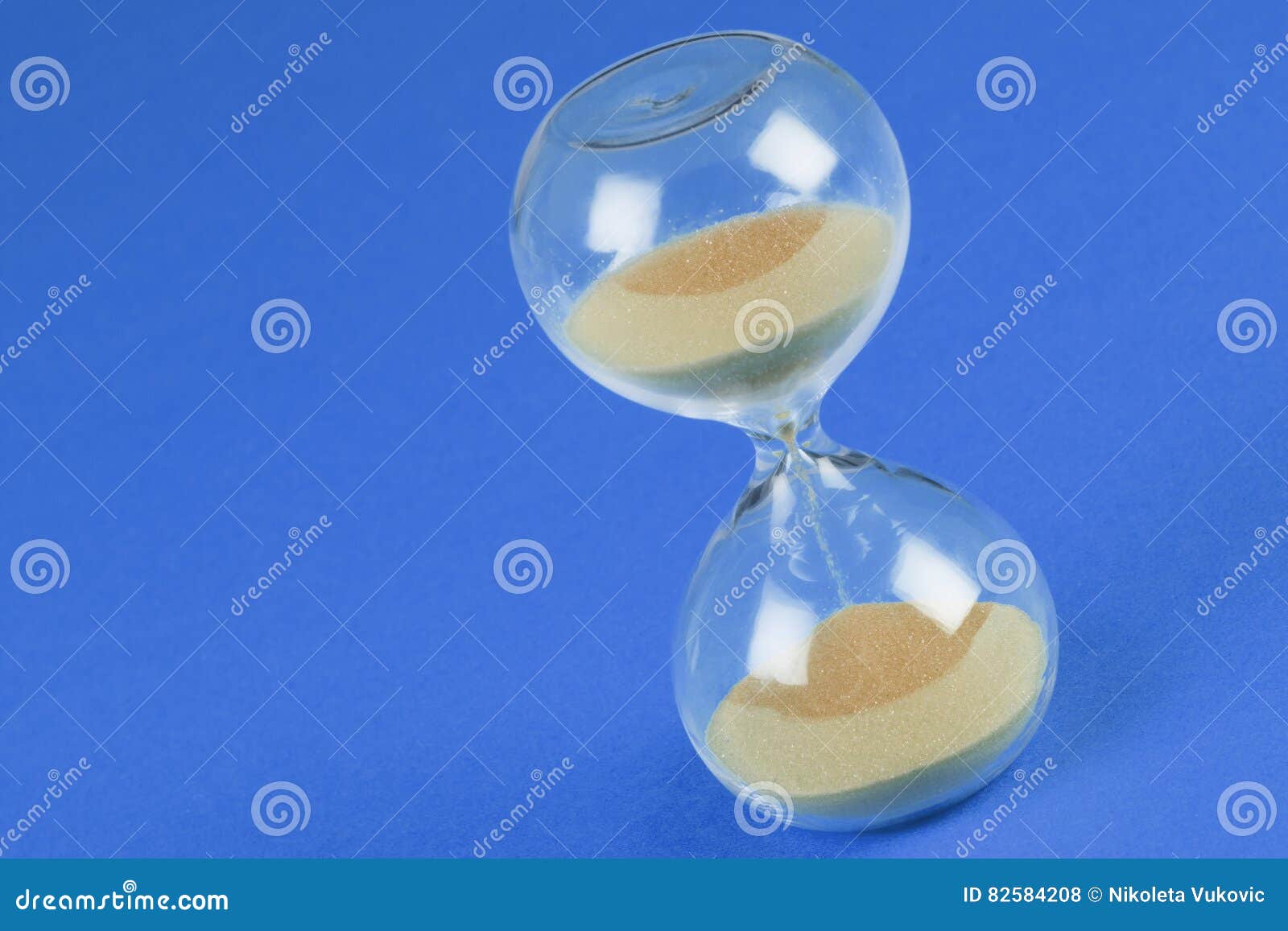 Sand Clock on Blue Background Stock Photo - Image of liquid, colors ...