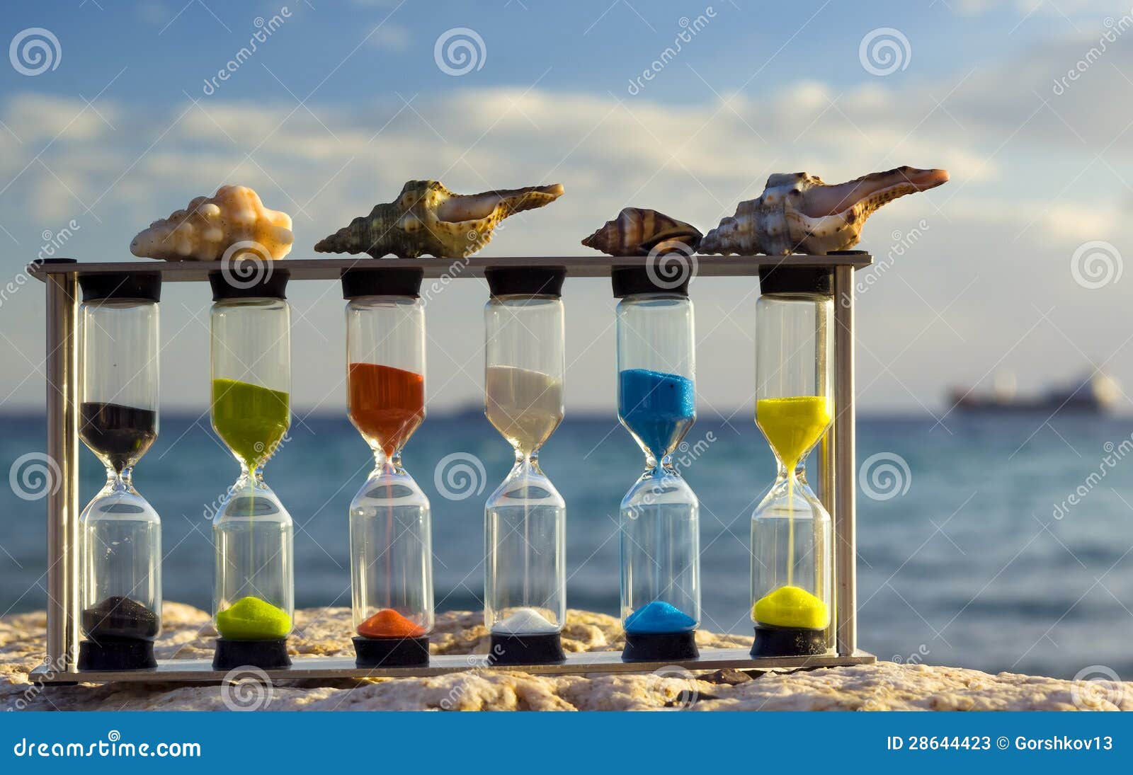 Sand-clock and Marine Shells Stock Image - Image of eilat, glass: 28644423