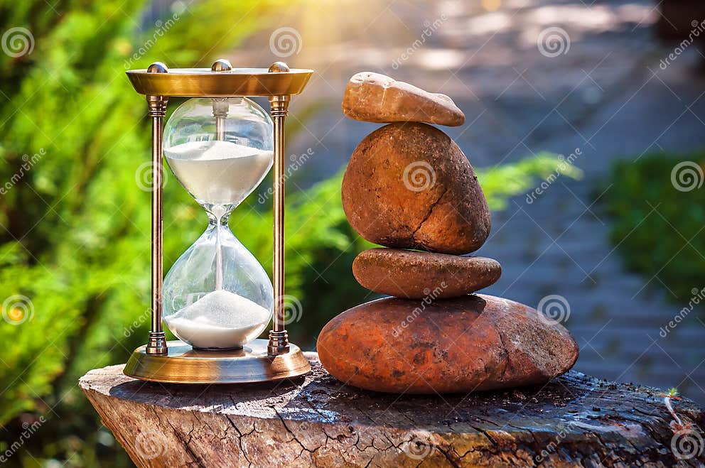 Sand Clock and Pebble Tower Stock Image - Image of business, hourglass ...