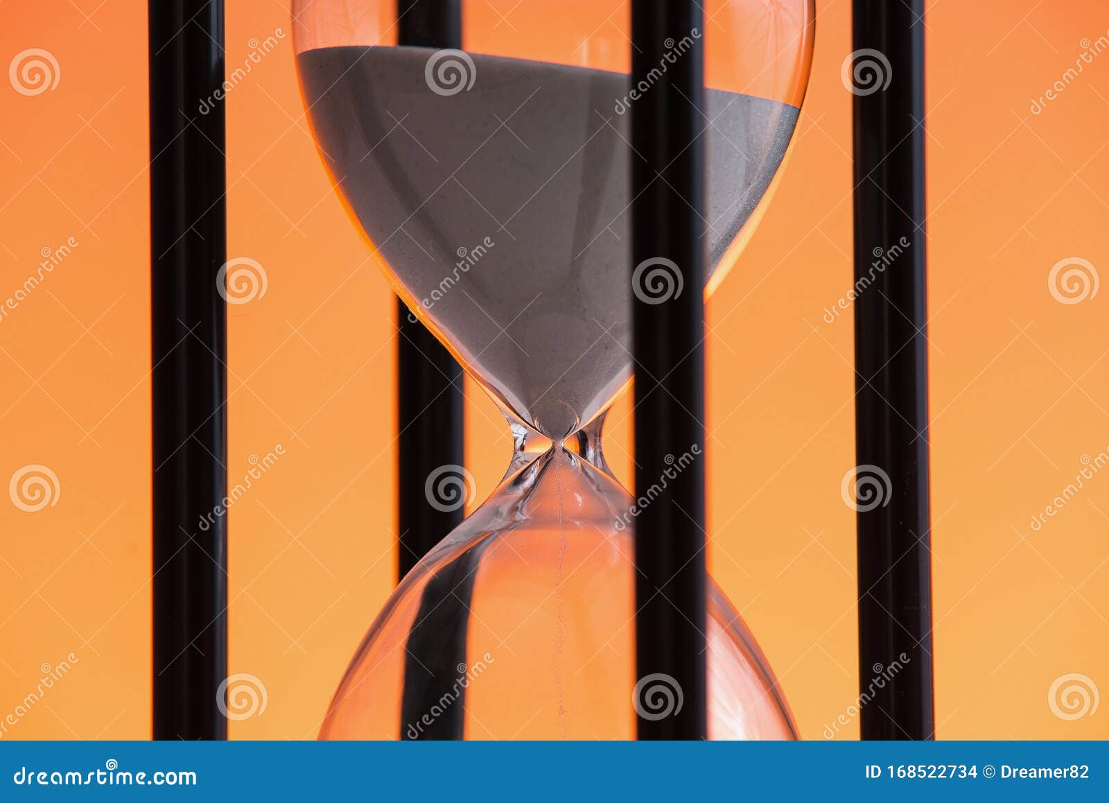 Sand Clock on Yellow Background Stock Photo - Image of flowing ...