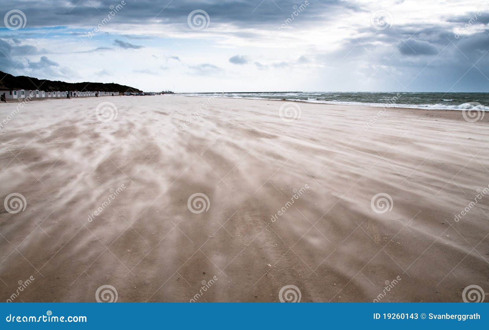 Sand drifting across beach stock image. Image of brown - 19260143