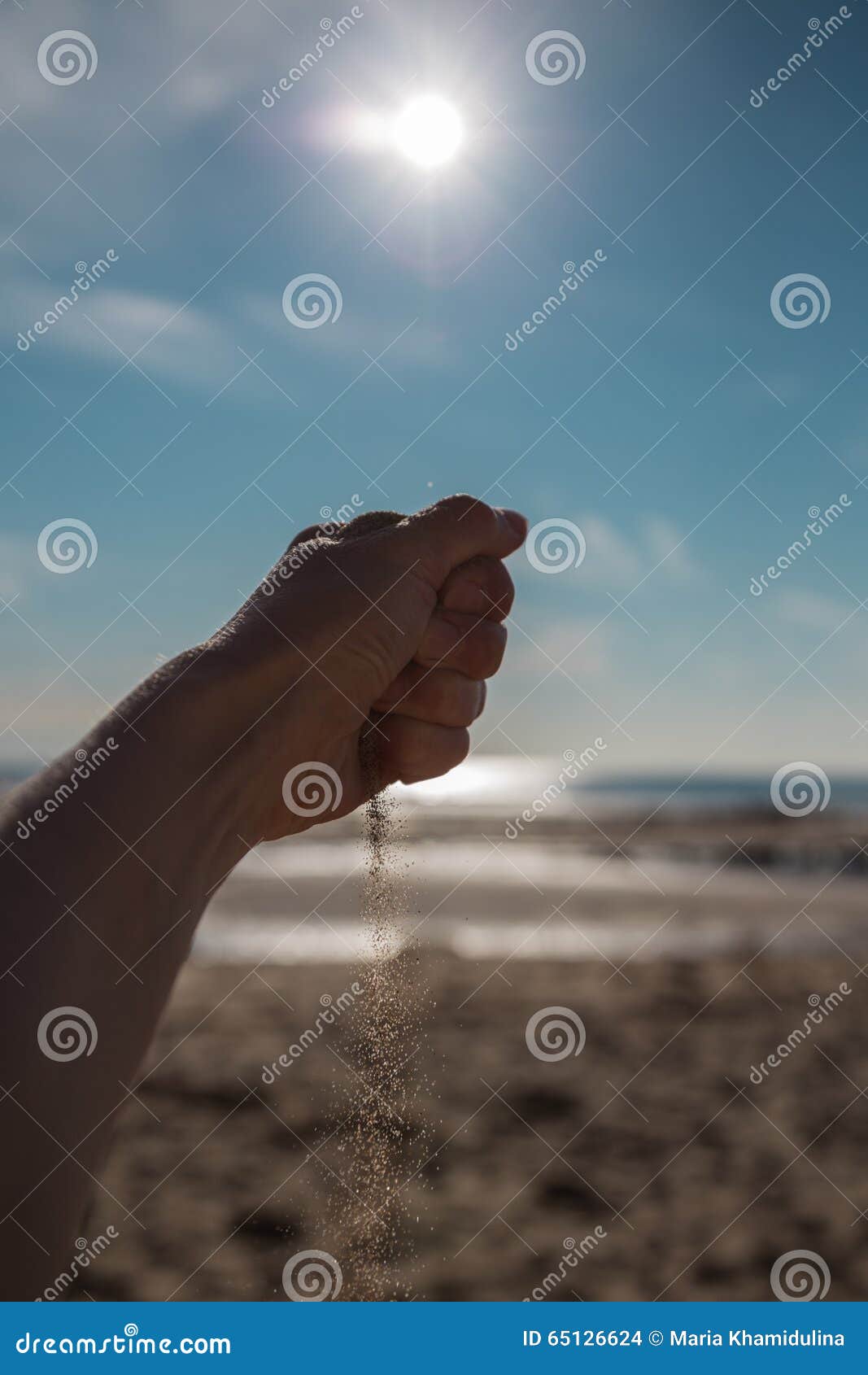Sand falling from the hand stock photo. Image of coastline - 65126624