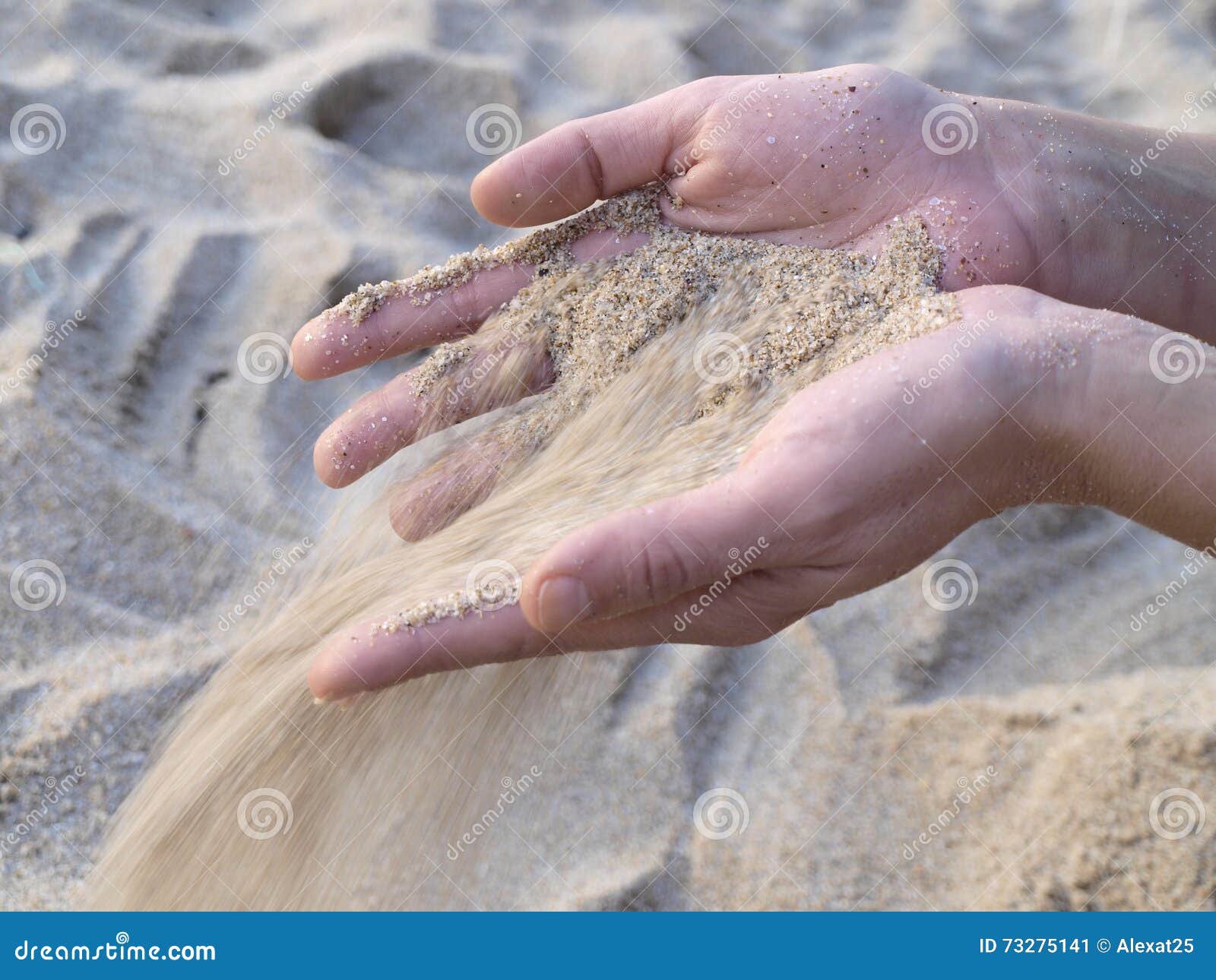 Sand falling from hands stock image. Image of recreation - 73275141