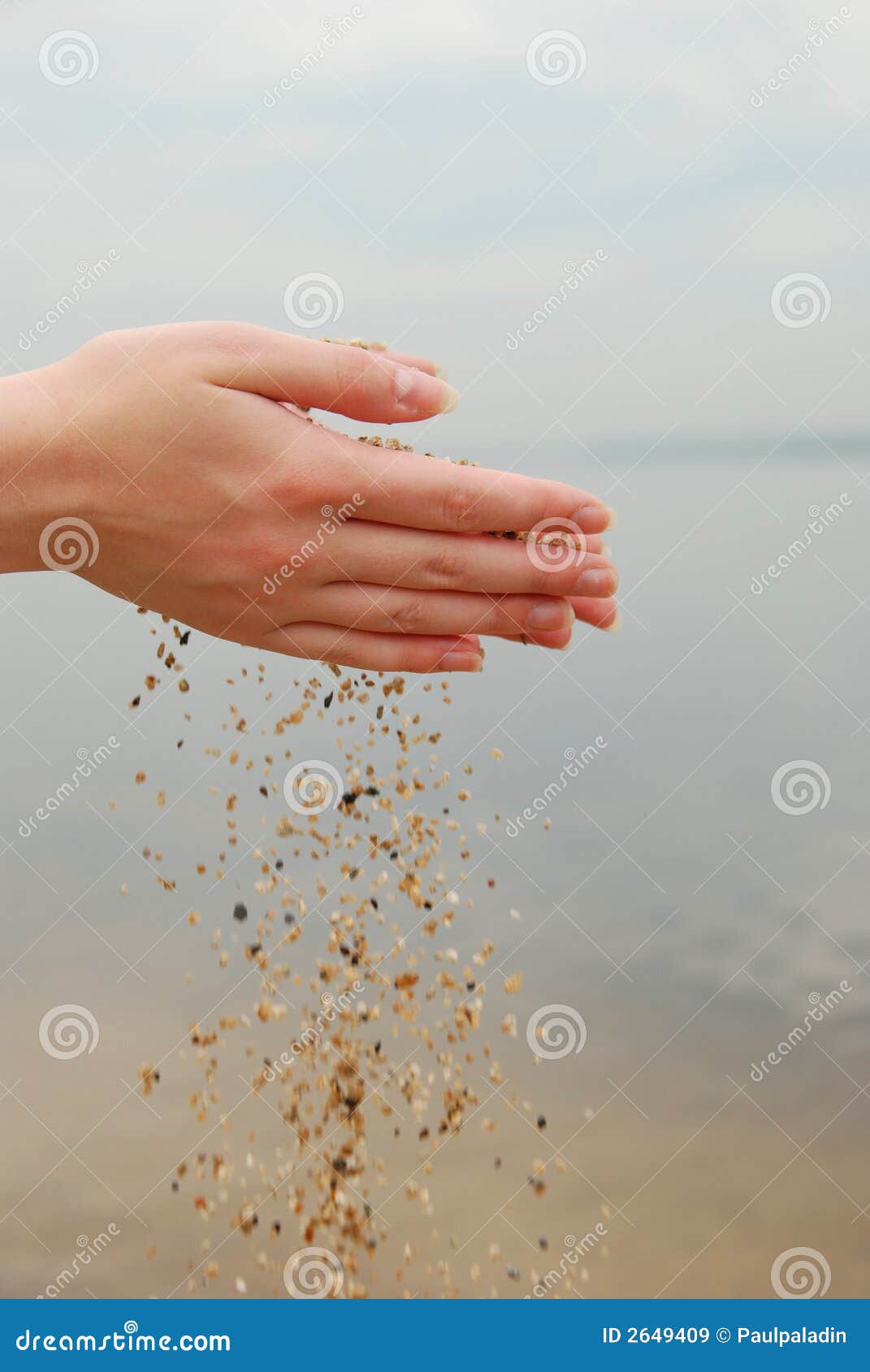 Sand in female hands stock image. Image of monotone, blue - 2649409