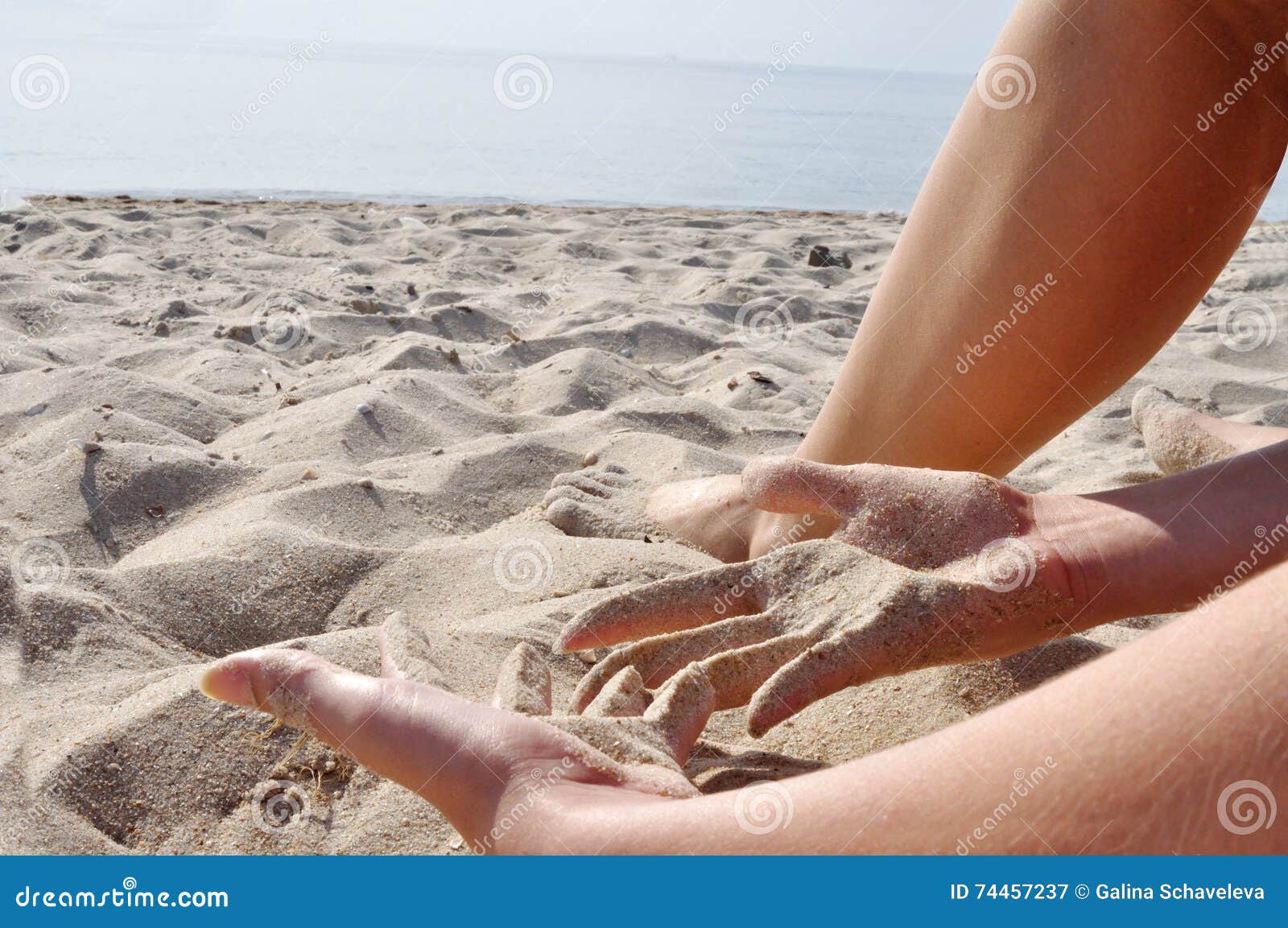 Sand on finger of the girl stock image. Image of finger - 74457237