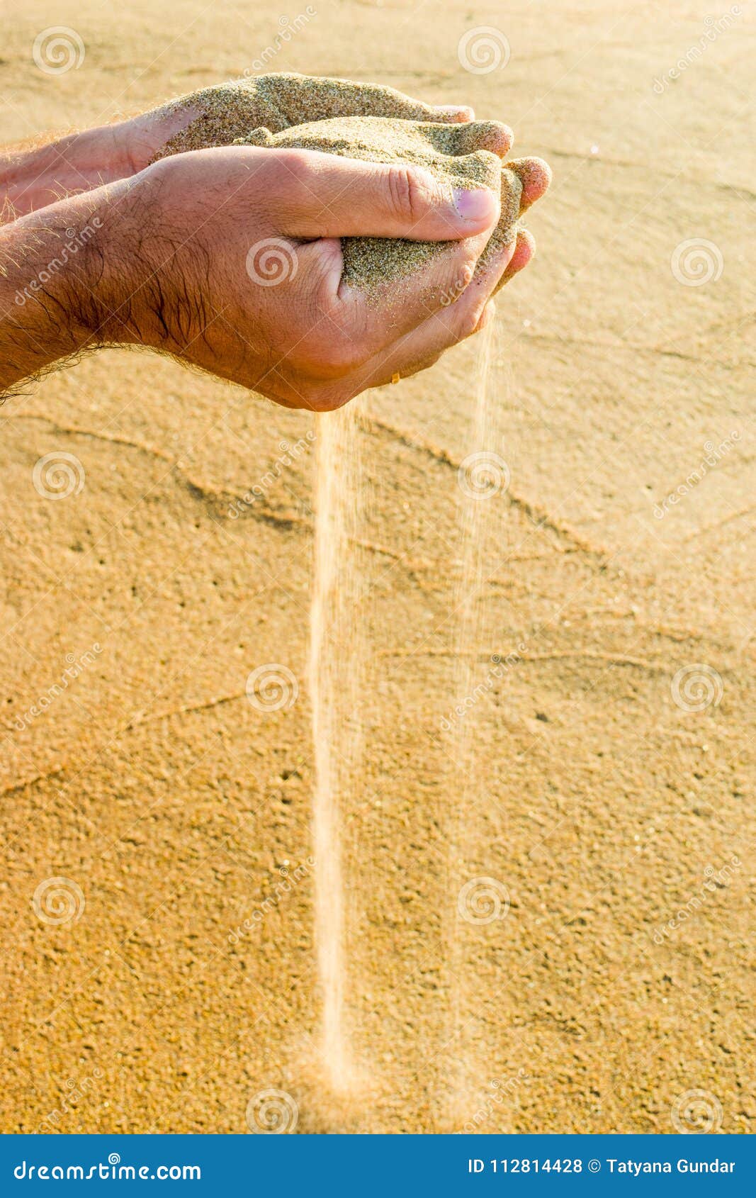 Sand through fingers. stock photo. Image of life, holiday - 112814428