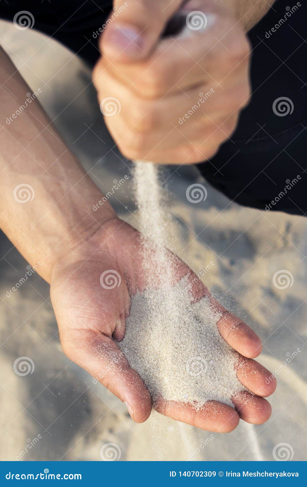 Sand Flowing through Your Fingers. Hand with the Sand Stock Image ...