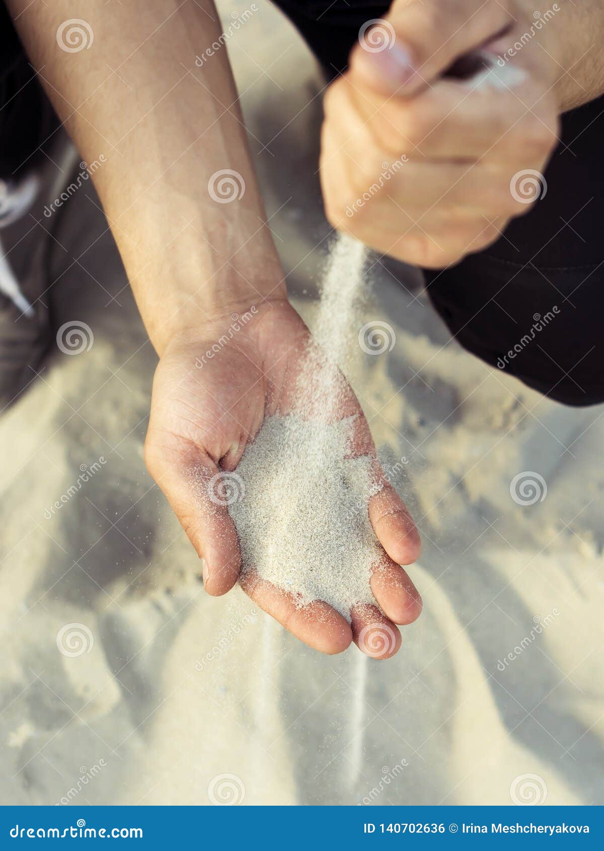 Sand Flowing through Your Fingers. Hand with the Sand Stock Photo ...
