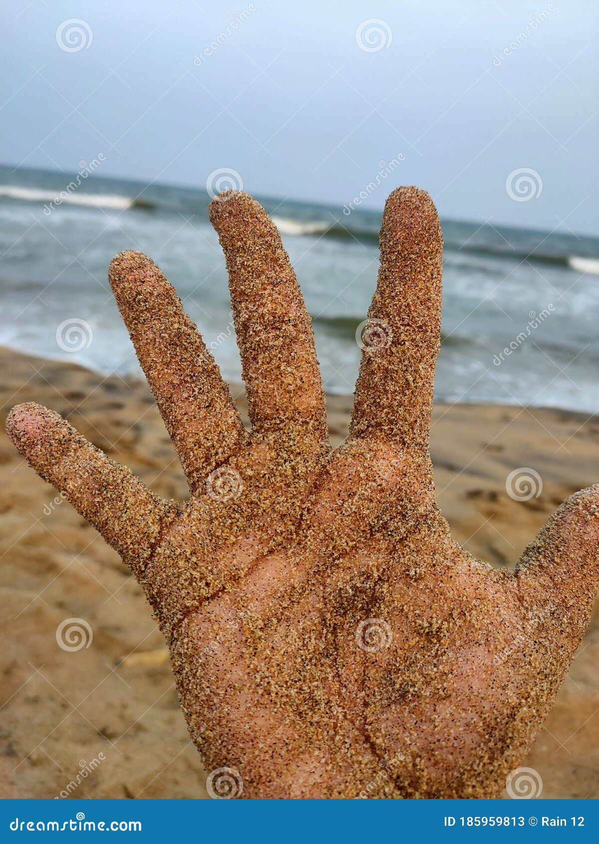 Sand in hand. stock image. Image of mobilephotography - 185959813