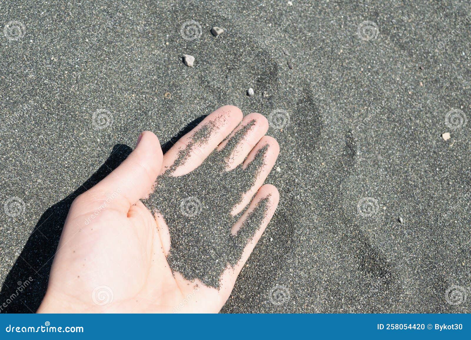The Man Holds the Sand in His Hand. Beach. Black Sands Stock Photo ...