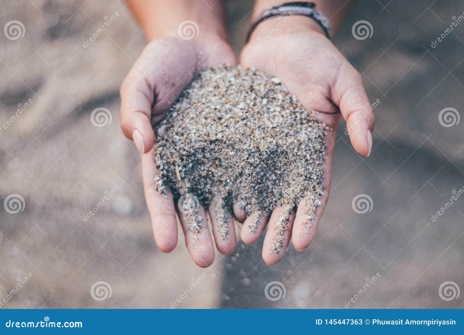 Sand on hand stock image. Image of holding, closeup - 145447363