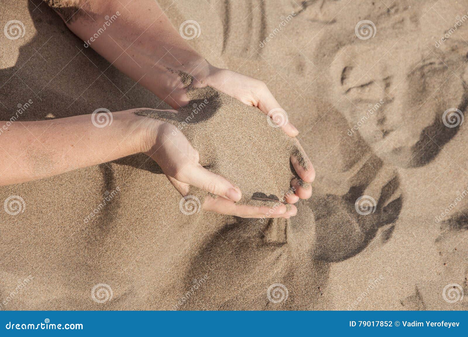 Sand in hands stock photo. Image of human, yellow, hands - 79017852
