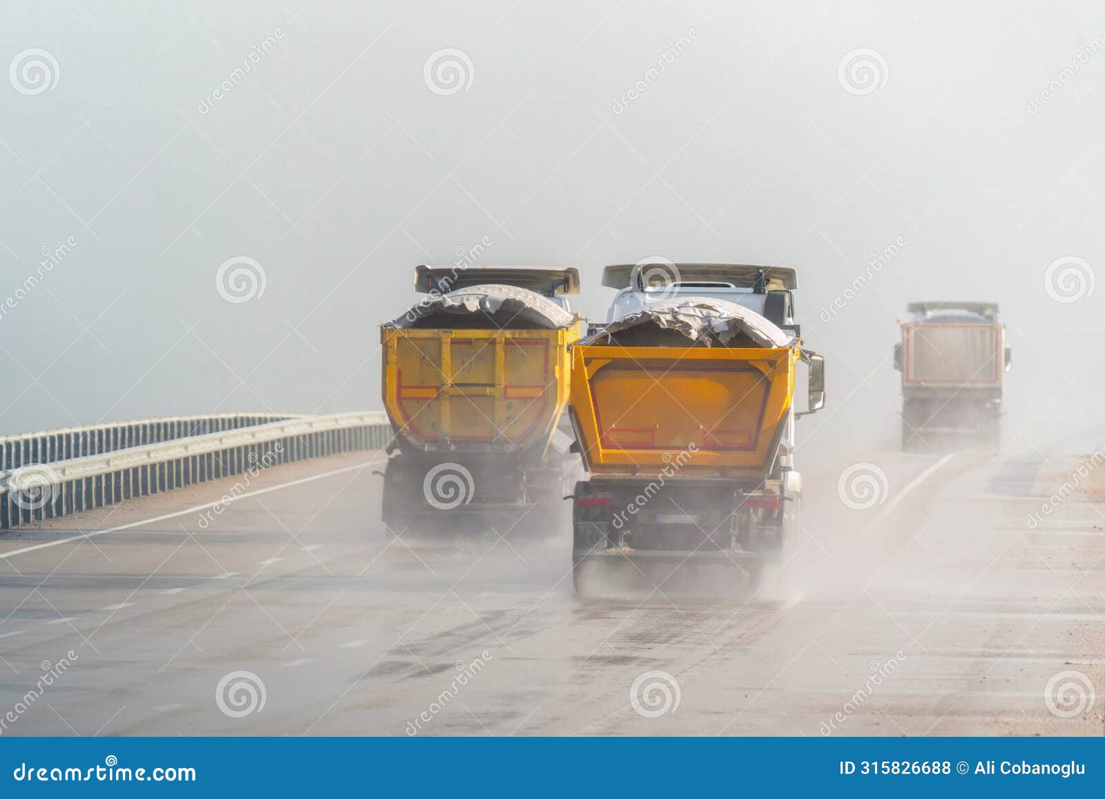 Sand Lorries Driving on Motorway in the Rain. Motorway in the Rain ...