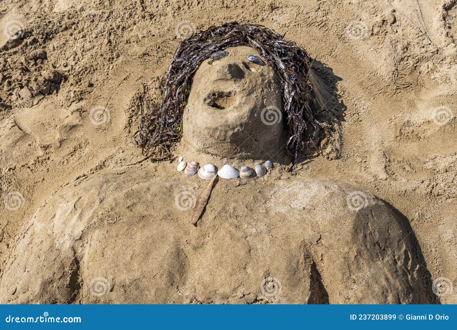 Sand Man Sculpture on the Beach with Decorations Stock Image - Image of ...