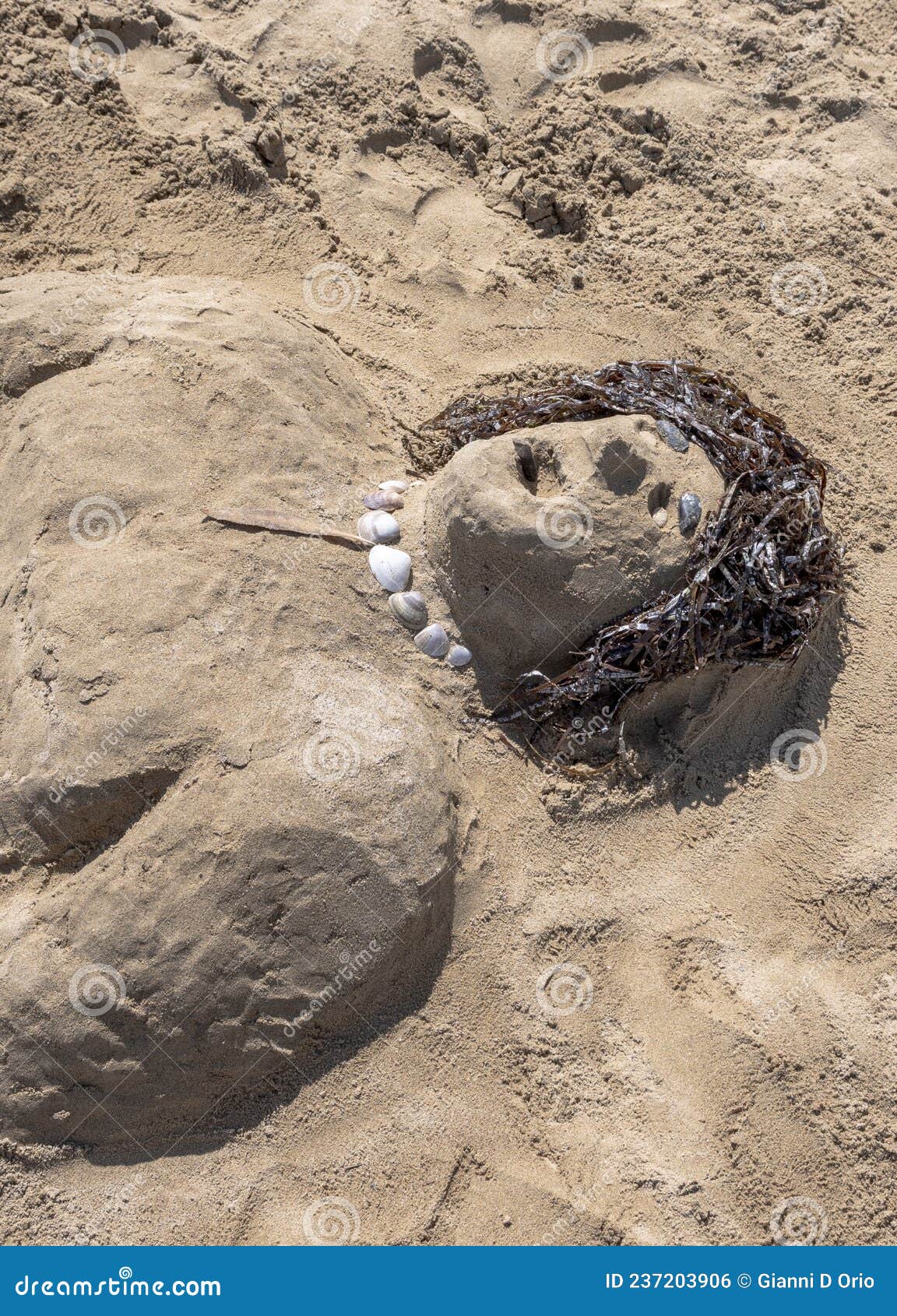 Sand Man Sculpture on the Beach with Decorations Stock Photo - Image of ...