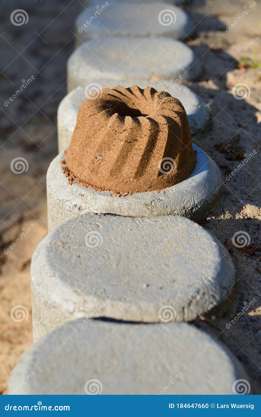 Sand Molds Side on a Playground in the Sand Stock Photo - Image of cake ...