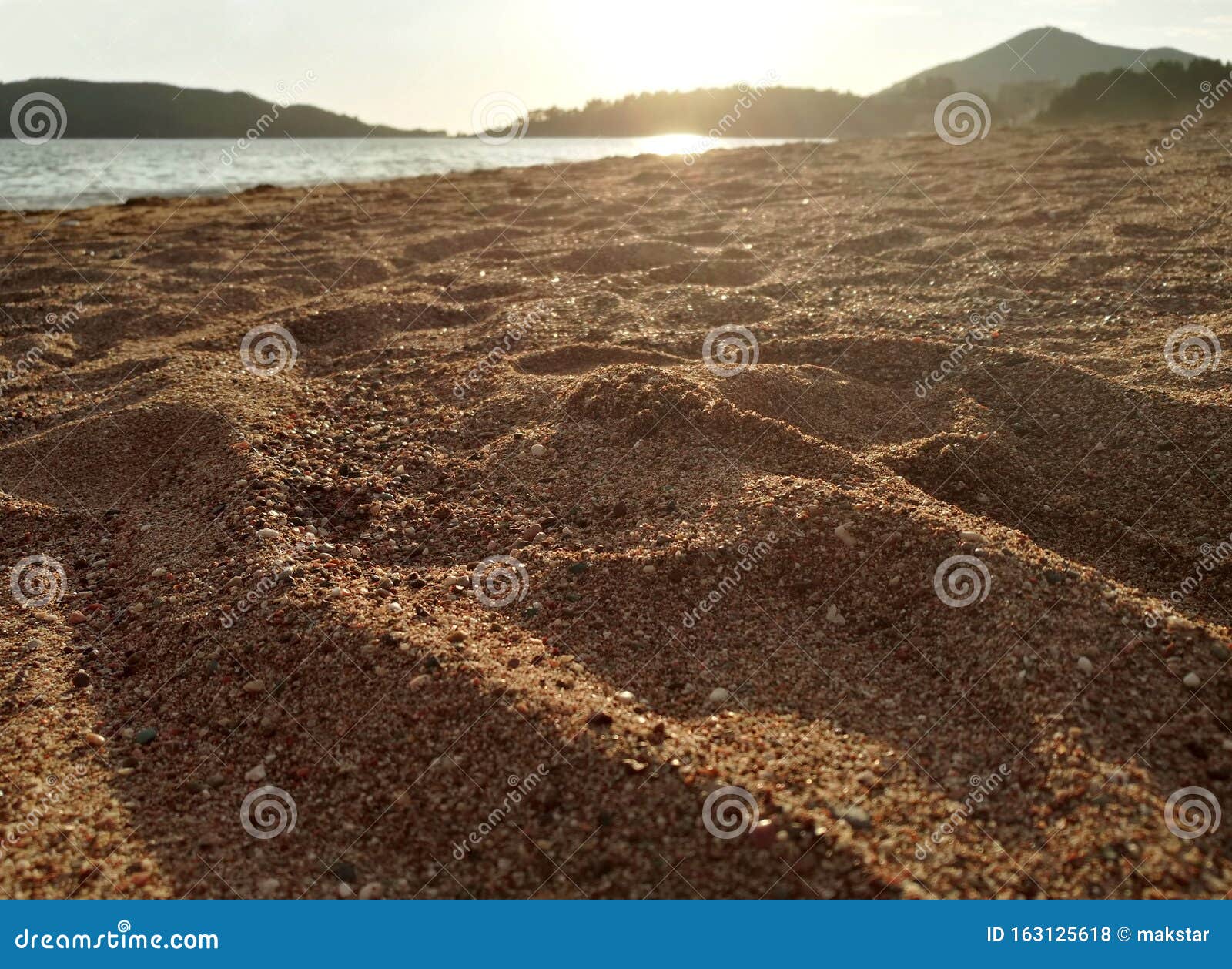 Sand and Pebble Beach on Sunset Stock Photo - Image of stone, sunset ...