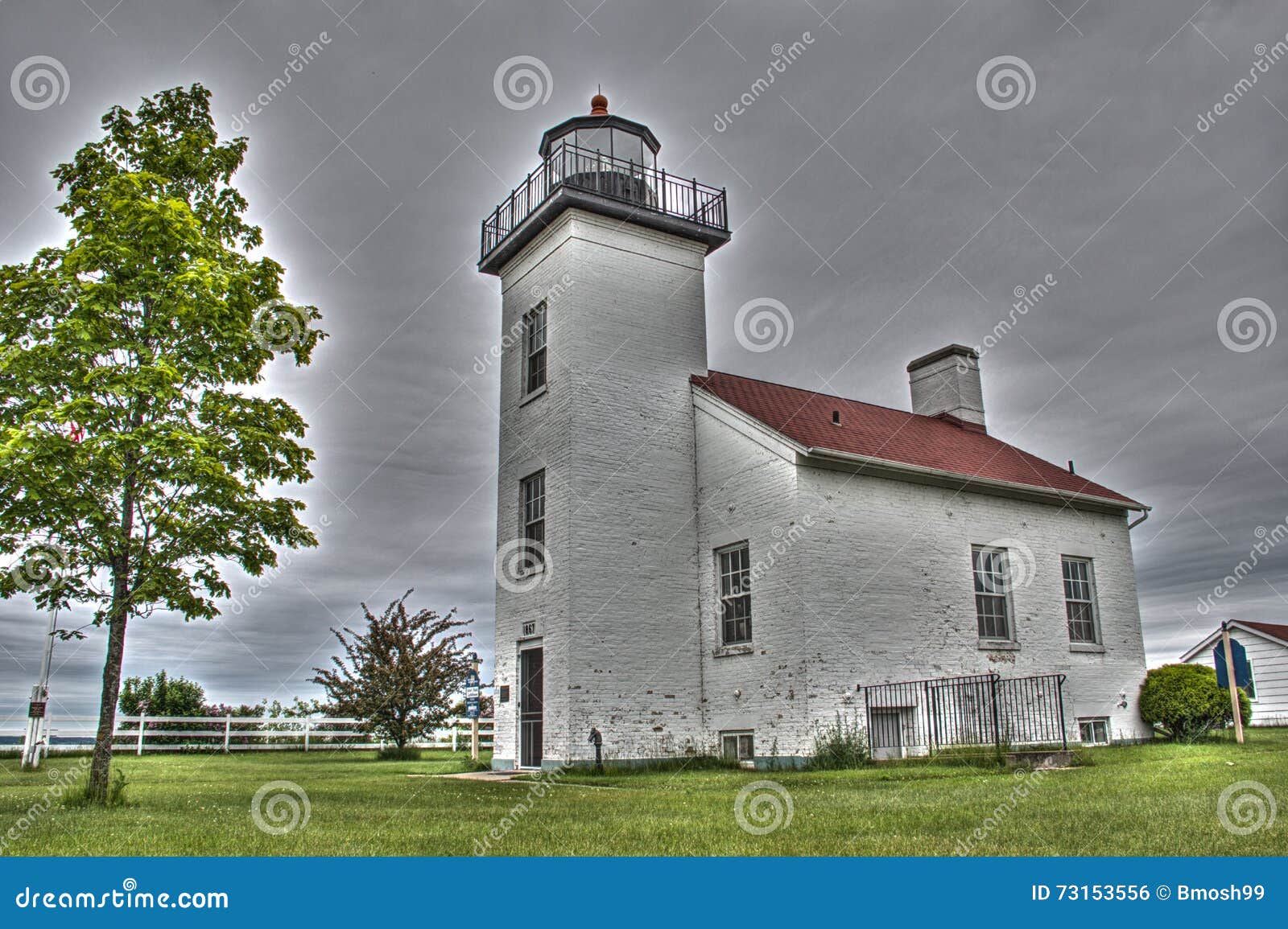 Sand Point Lighthouse stock photo. Image of clouds, sand - 73153556