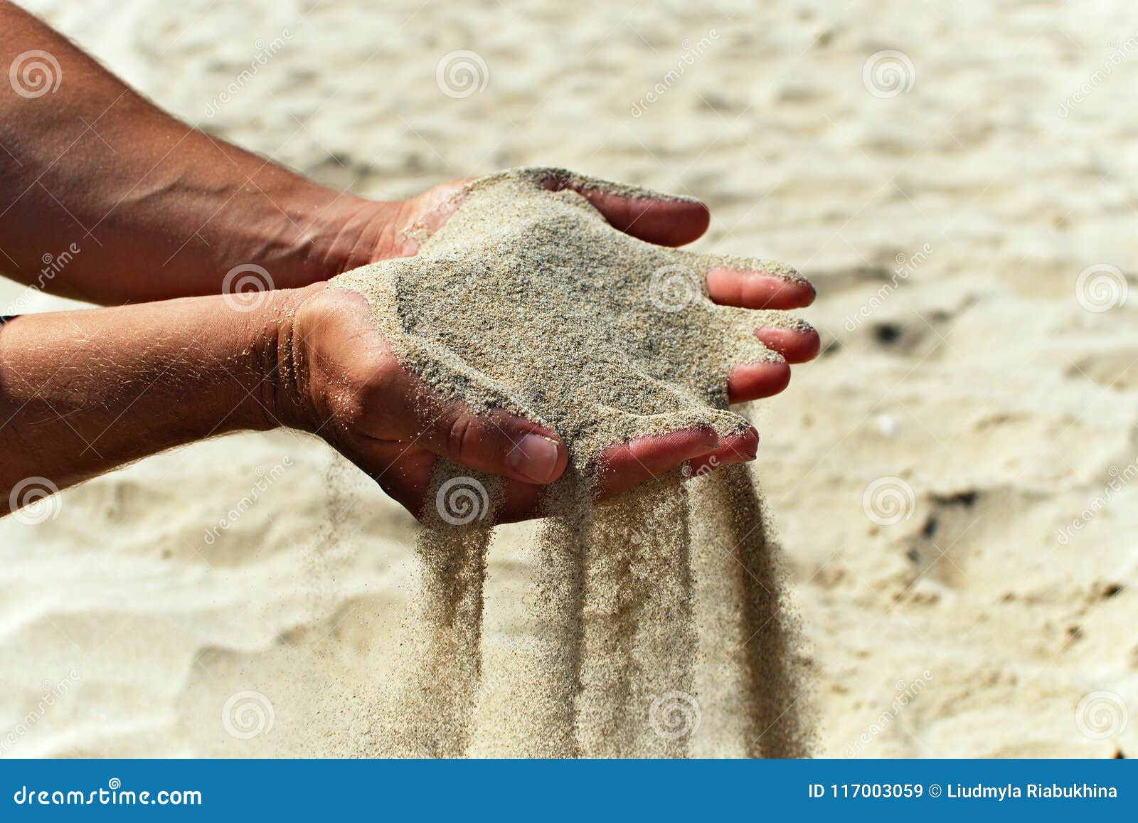 Sand Poured Down from Hands Stock Image - Image of beach, fingers ...