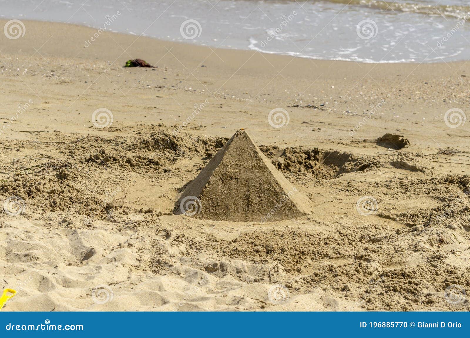 Sand Pyramid on the Beach by the Sea Stock Photo - Image of fantasy ...