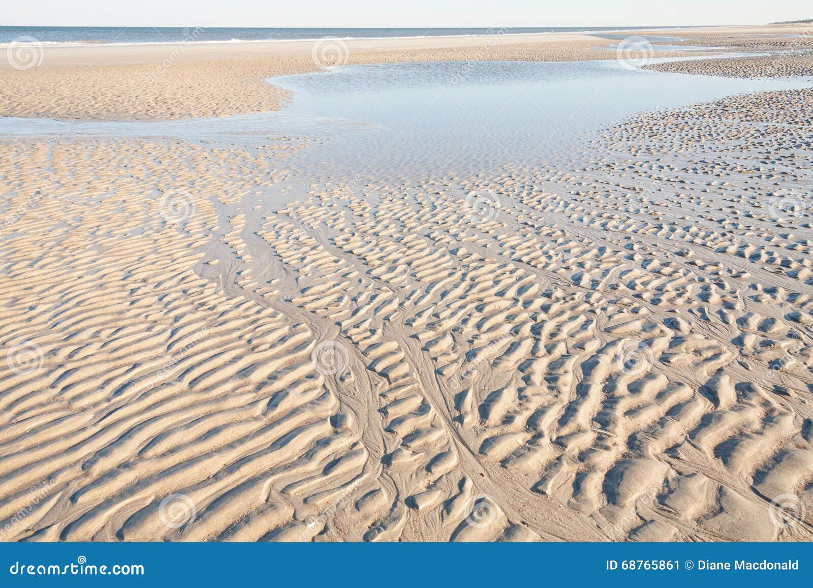 Sand ripples on the beach stock image. Image of beach - 68765861