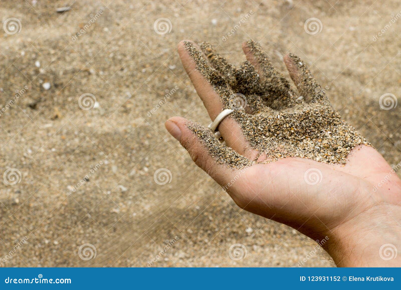 Sand Running Out from Hand at the Beach Stock Photo - Image of sandy ...