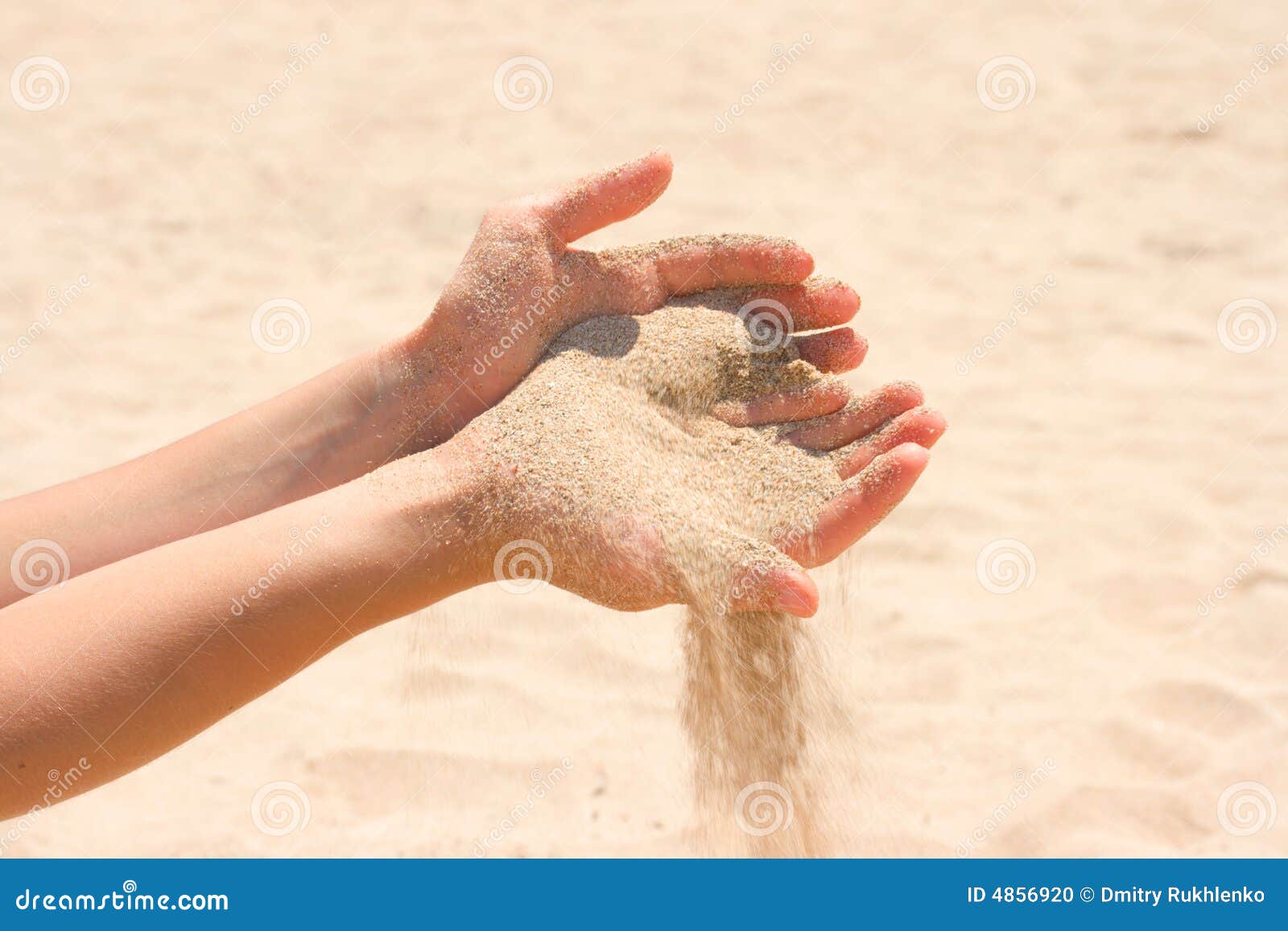 Sand running through hands stock photo. Image of leaking - 4856920